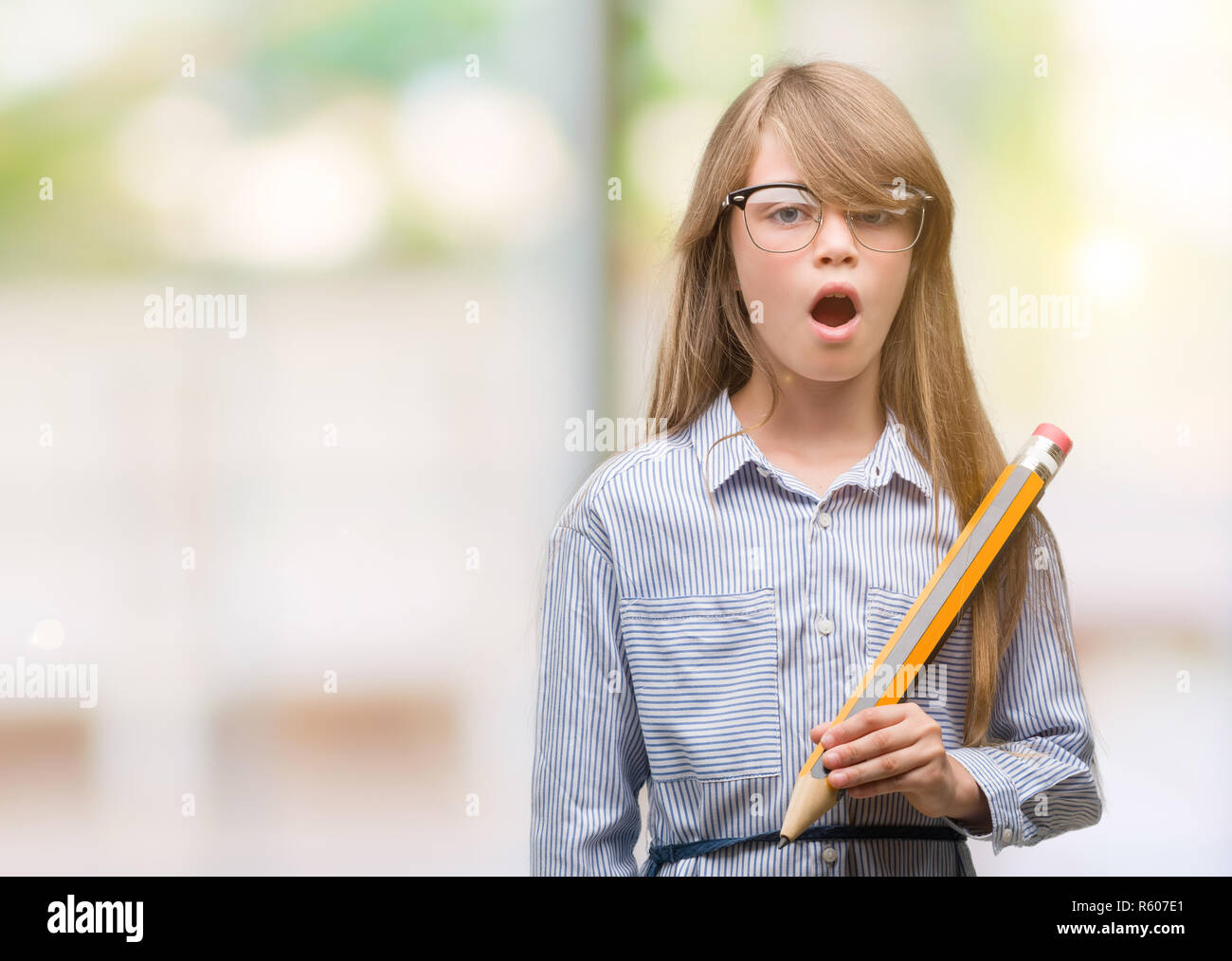 Child pencil in mouth hi-res stock photography and images - Alamy