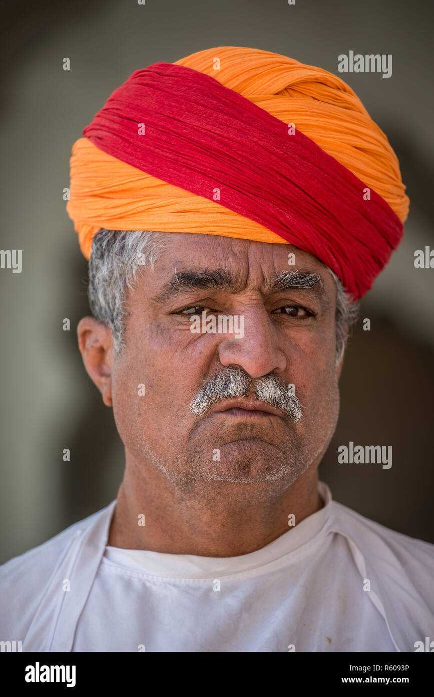 Guard with mustache and red and yellow turban at Mehrangarh Fort ...