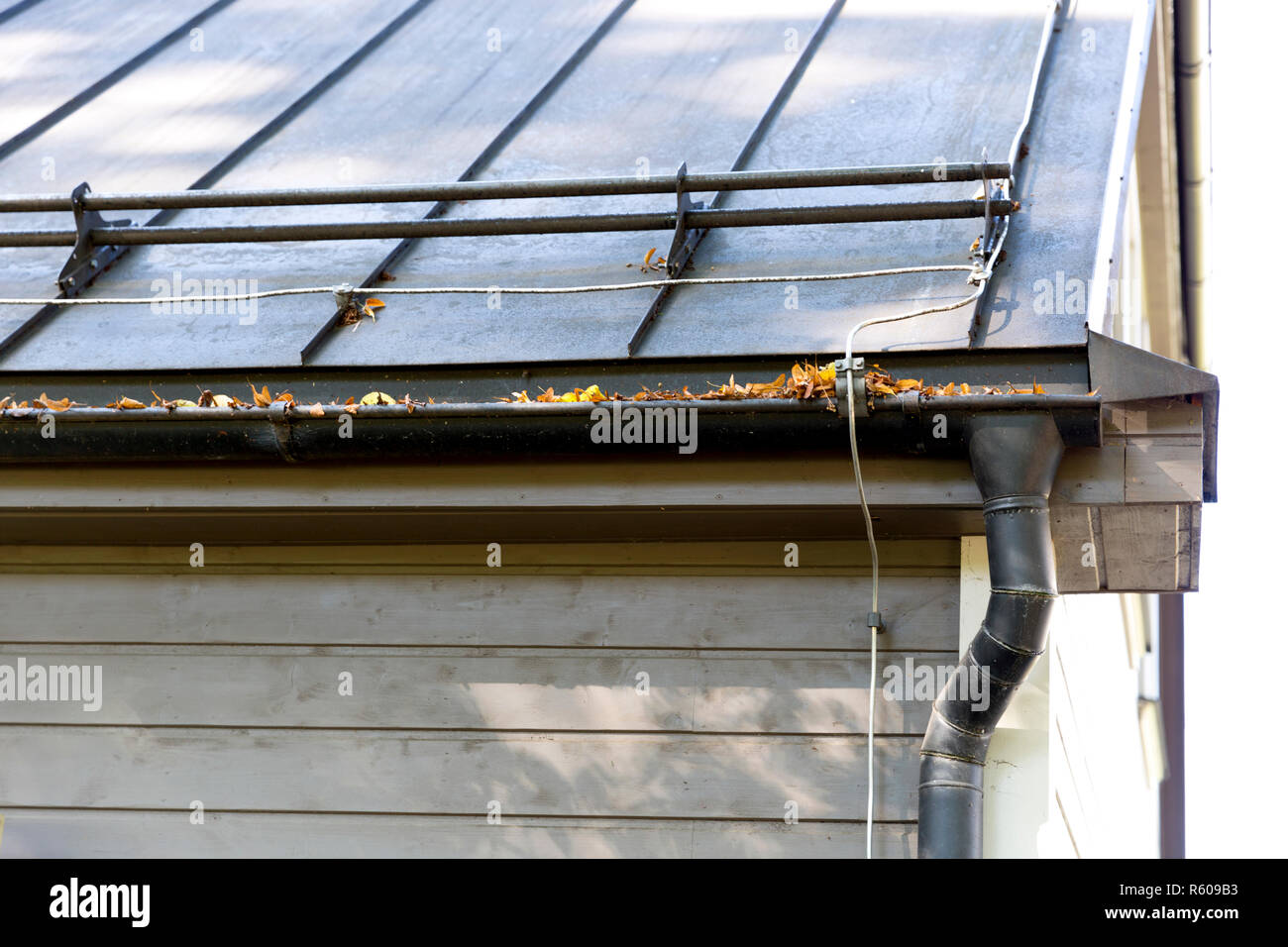 Rain gutter pipeline system installation. Roofing construction. Rain ...