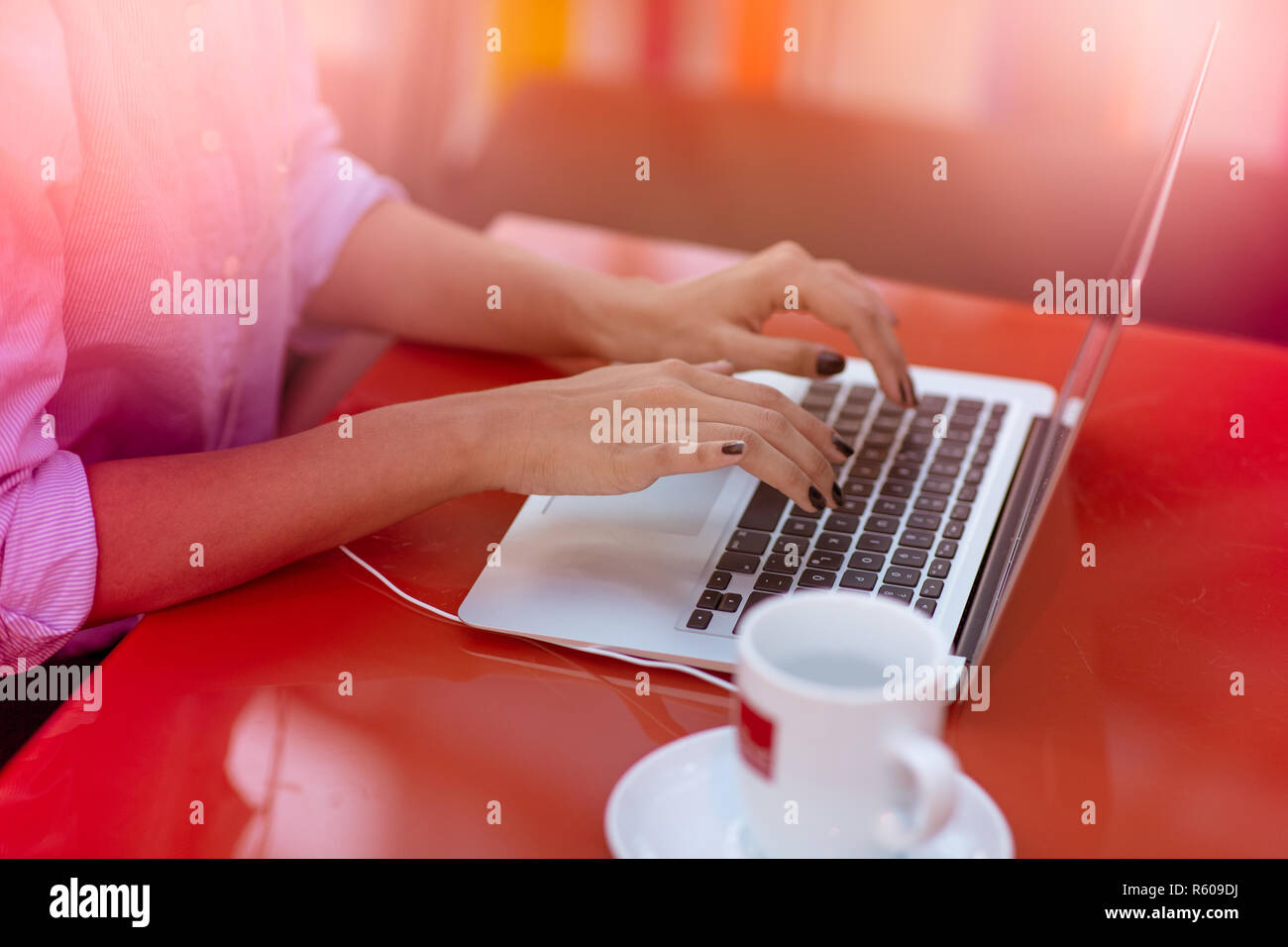 Hands of woman typing on the keyboard of her laptop computer. Female ...