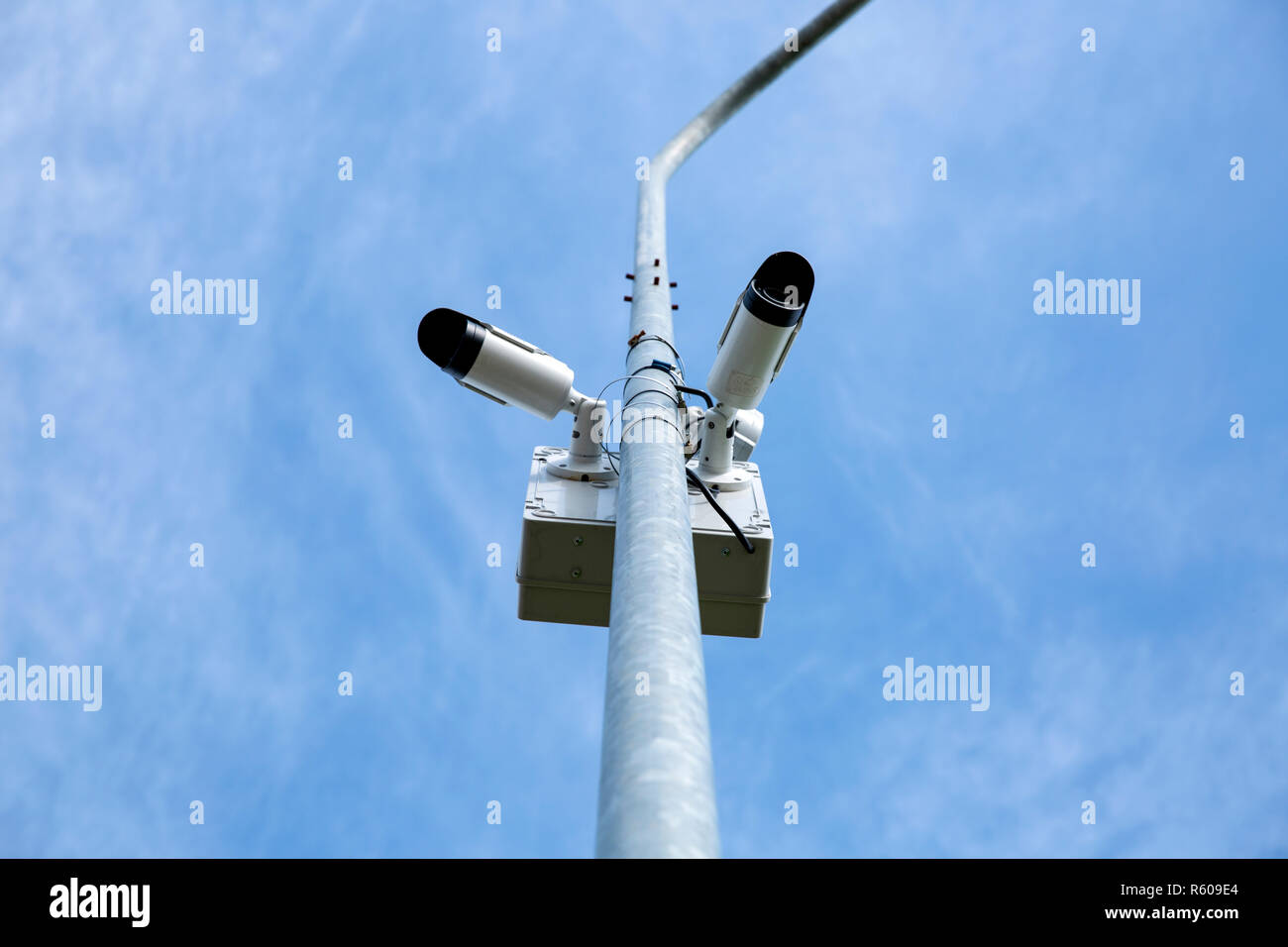 Surveillance camera against blue sky Stock Photo - Alamy