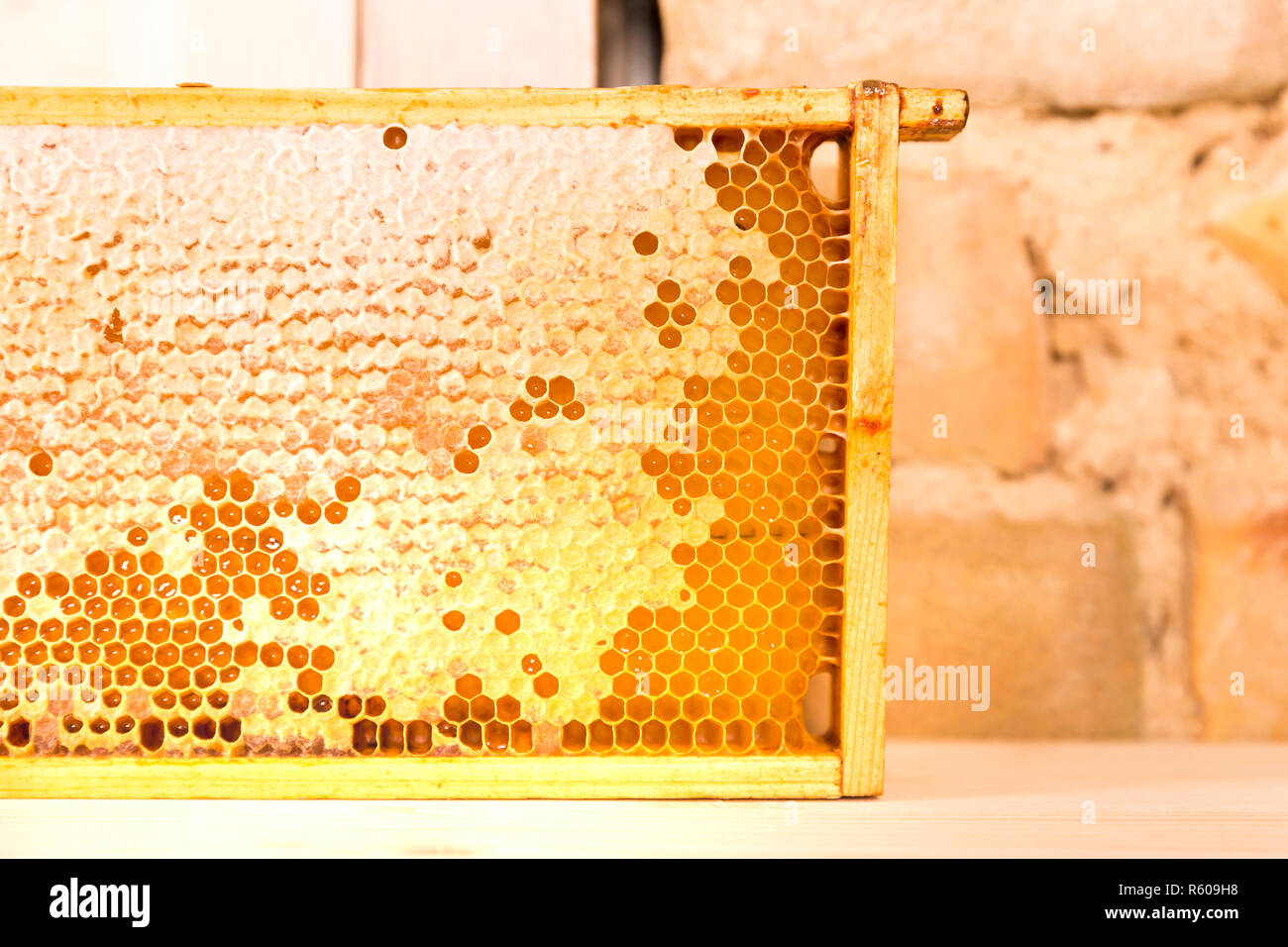 wooden frame with honeycomb full of honey Stock Photo - Alamy