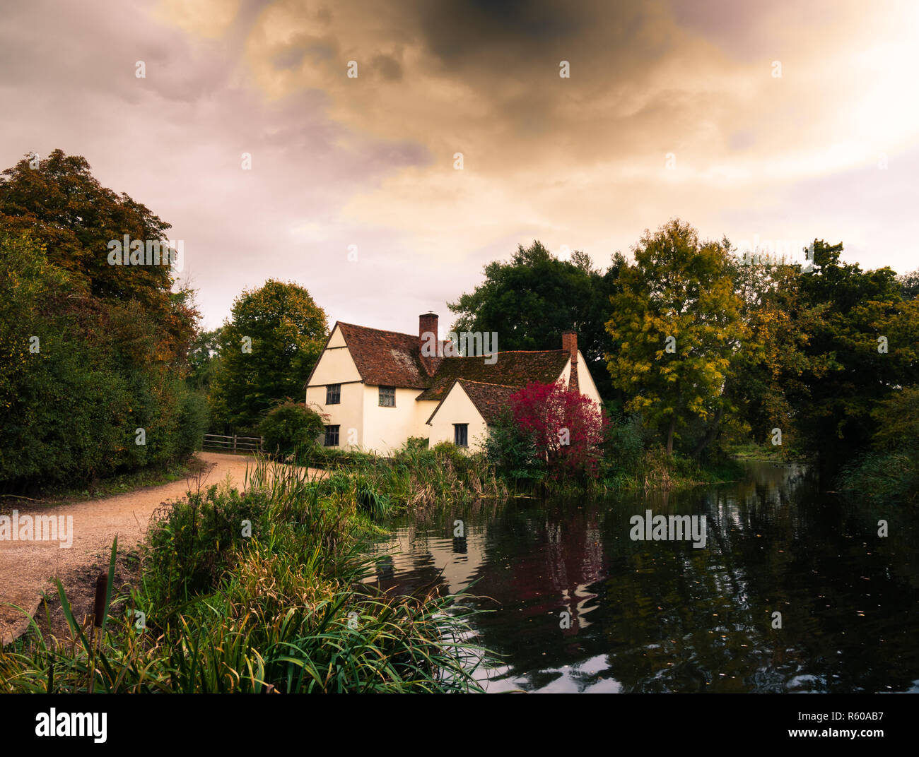 Stunning autumn english country mill cottage house Stock Photo - Alamy