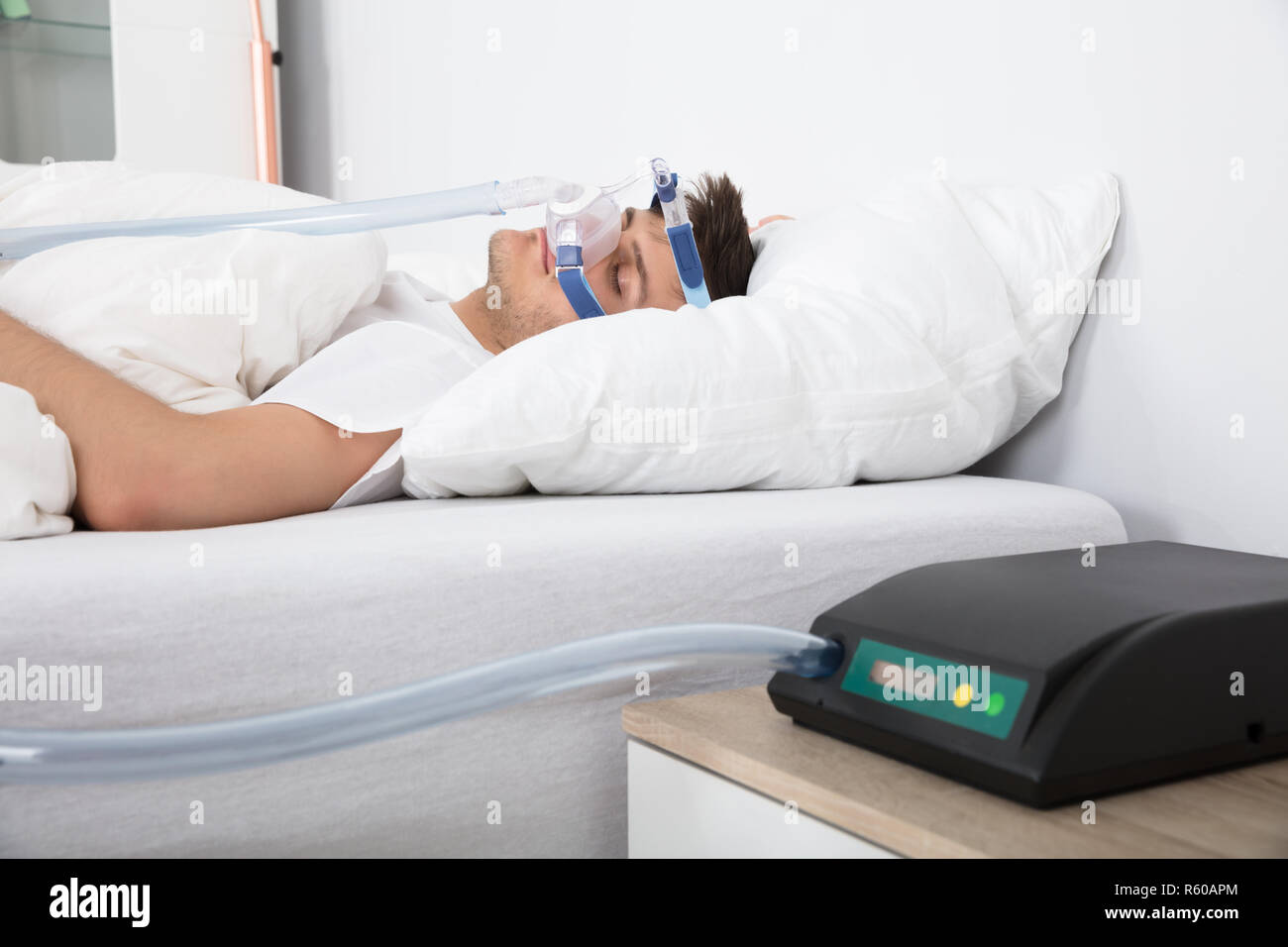 Sleeping with cpap machine hi-res stock photography and images - Alamy