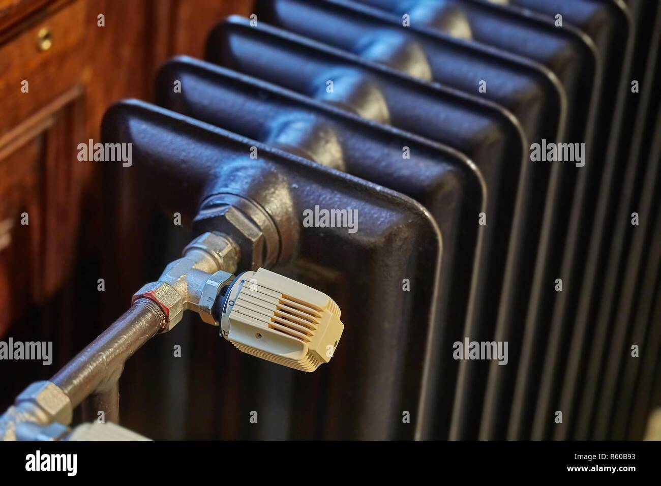 Radiator with tiled wall Stock Photo - Alamy