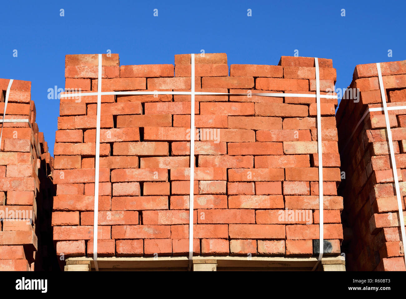 Red bricks stacked into cubes. Warehouse bricks. Storage brickwo Stock ...