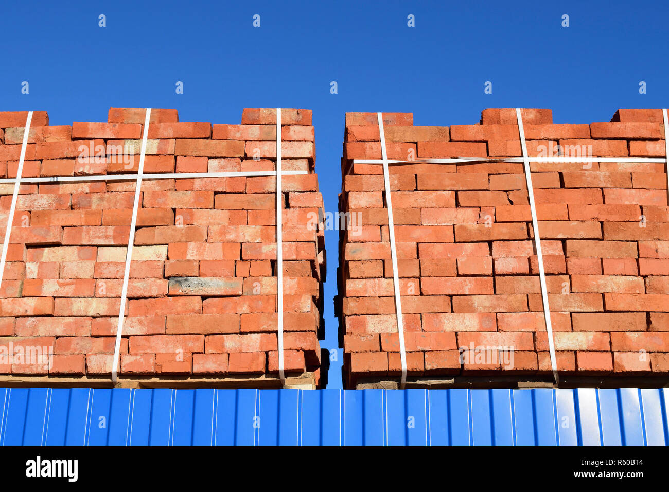 Red bricks stacked into cubes. Warehouse bricks. Storage brickwo Stock ...