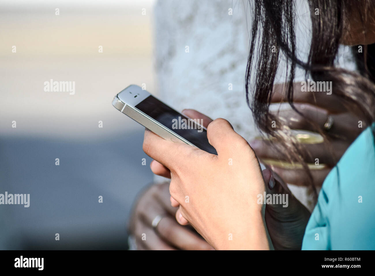 The mobile phone in hands Stock Photo - Alamy