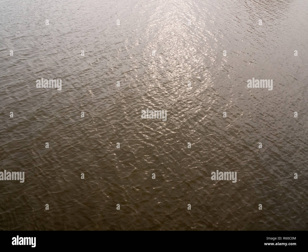 grey light streaked reflecting sea surface water background Stock Photo ...