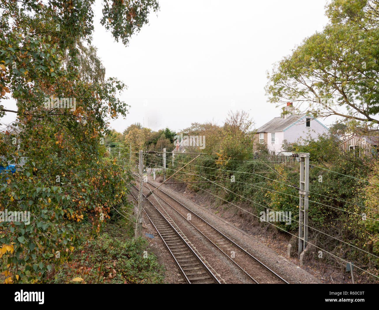 empty rail road tracks down below from bridge Stock Photo - Alamy