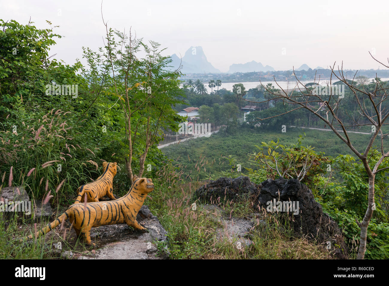 Horizontal picture of two tiger statues at Hpan Pu mountain located in ...