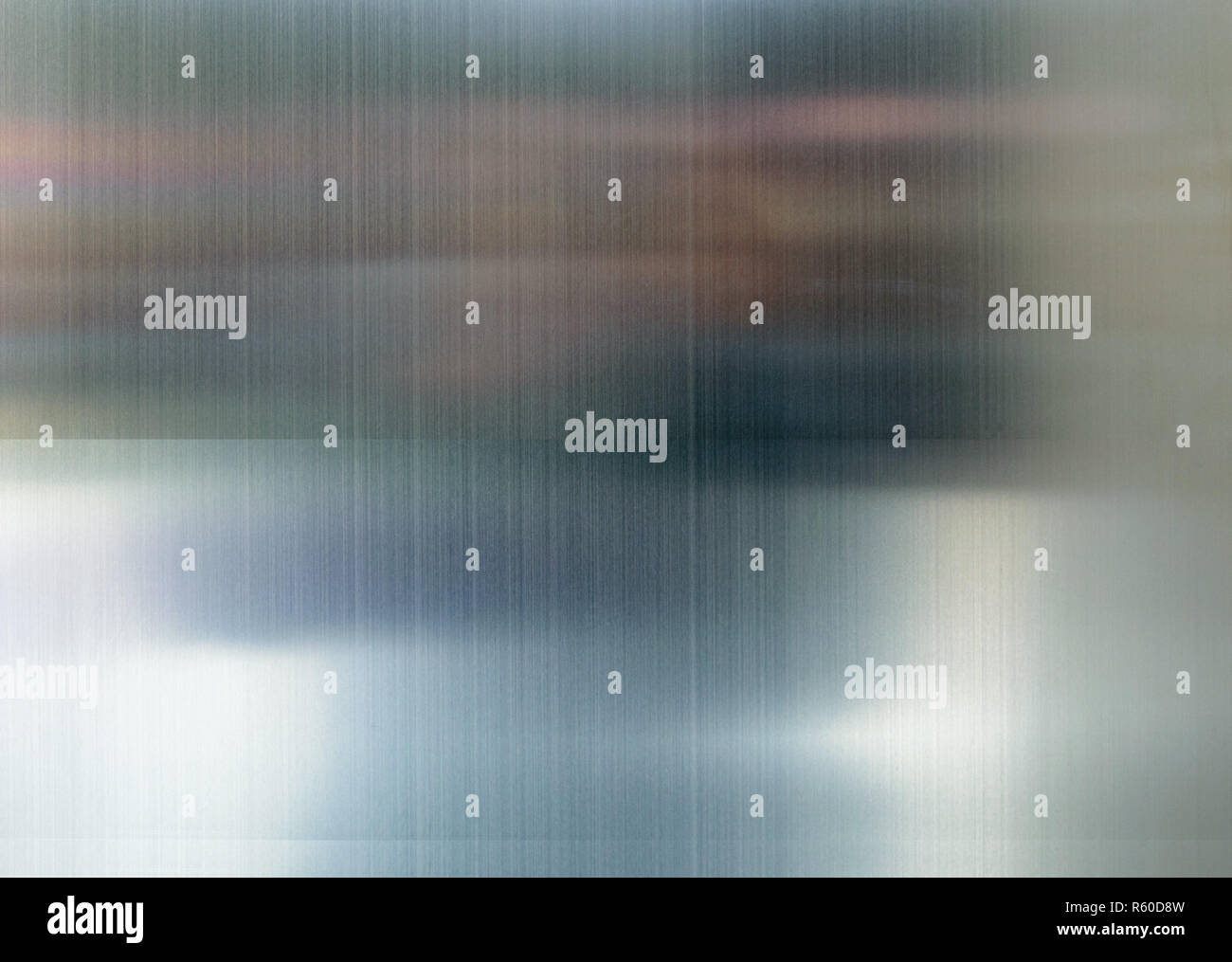 Convex polished shiny steel metal surface with colored reflections and ...