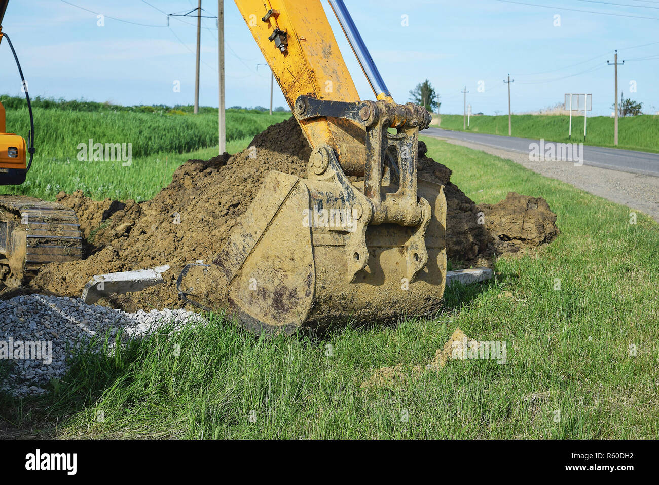 Bucket of the excavator on installation Stock Photo - Alamy