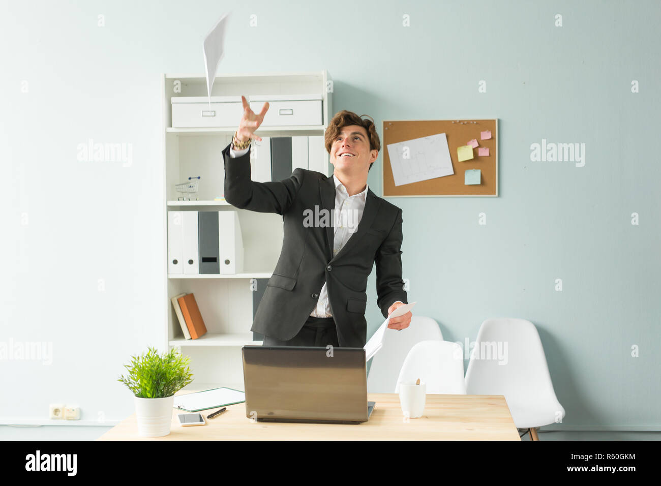 Business people, joke and fun concept - young handsome man in suit ...