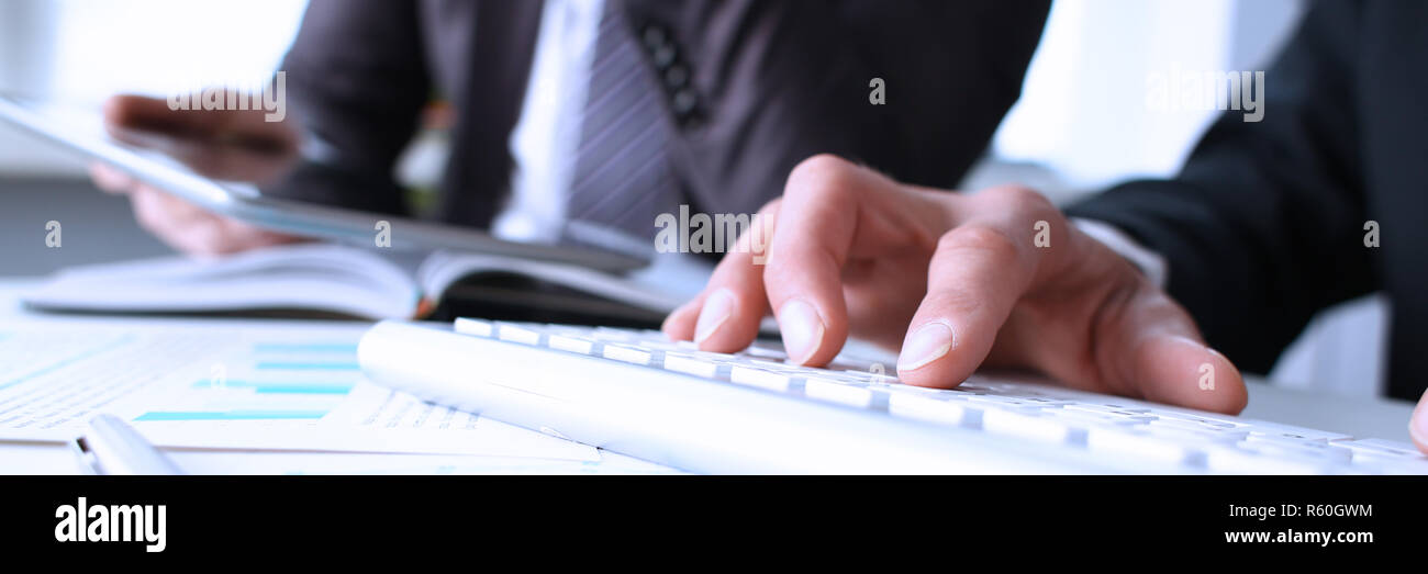 Male arms in suit typing on white Stock Photo - Alamy