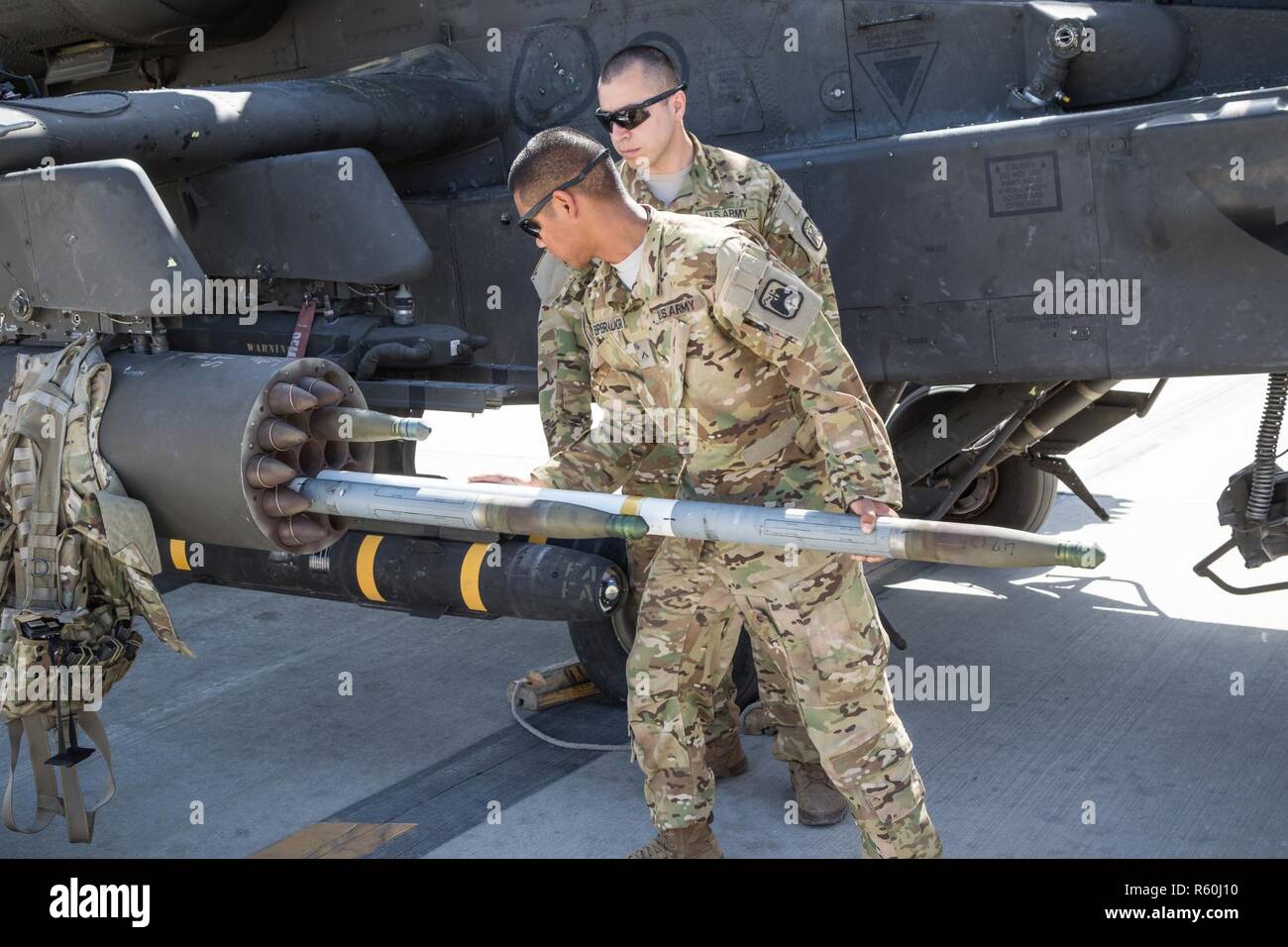 U.S. Army AH-64E Apache helicopter ground crew members assigned to Task ...