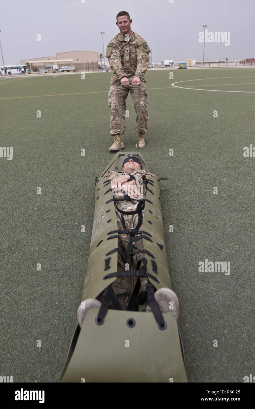 Spc. James Braid, with the 978th Composite Supply Company, demonstrates ...