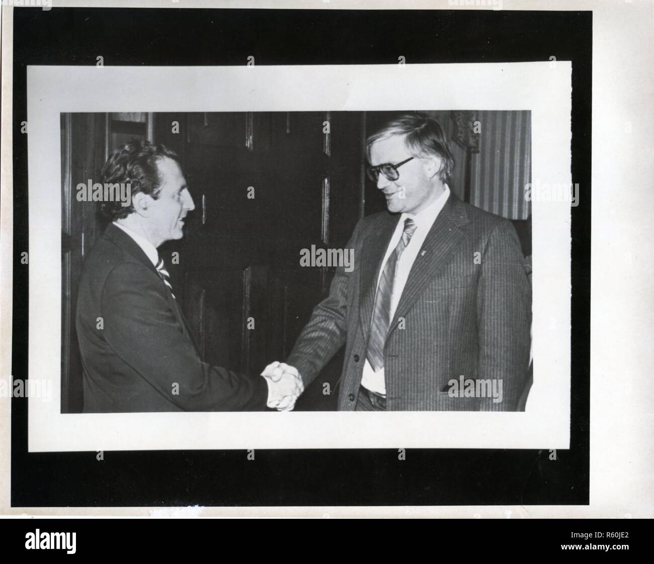 MISCELLANEOUS PHOTOS - Man giving handshake Stock Photo - Alamy