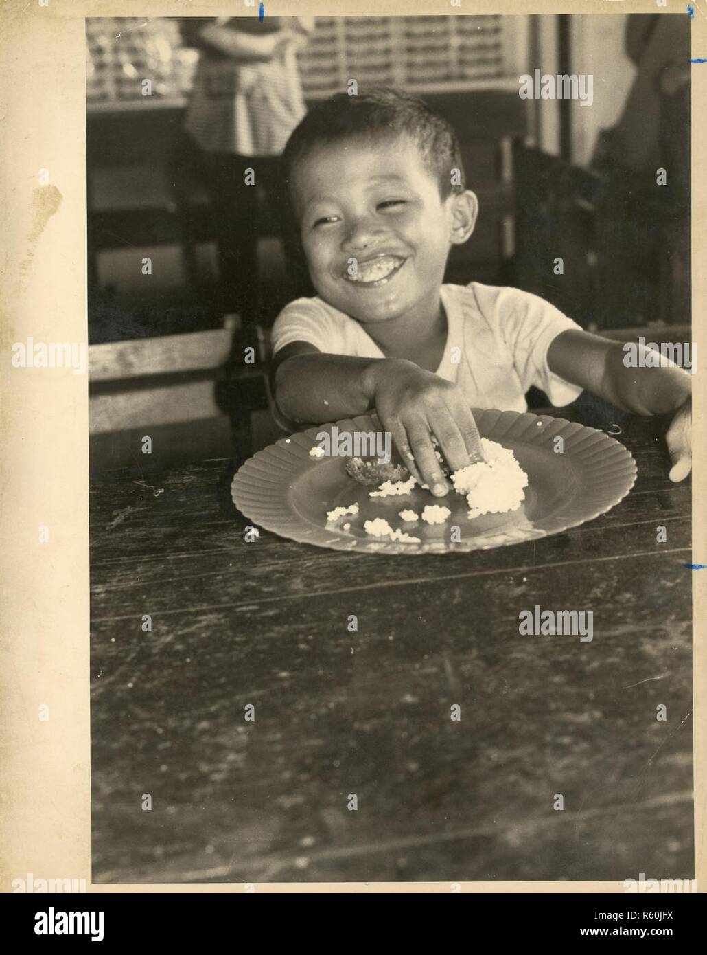 Philippines - Food & Nutrition - Boy eating rice Stock Photo - Alamy