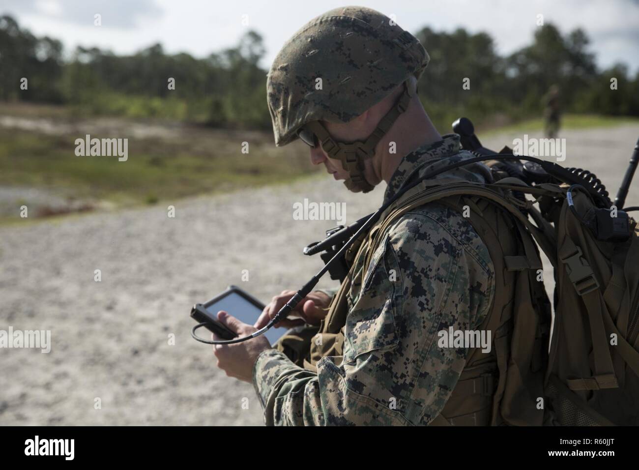 A Marine looks at a digital map on a Target Handoff System v2.0 during ...