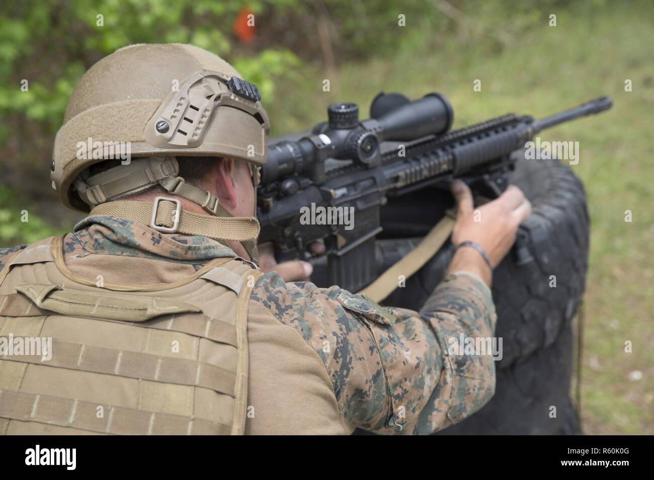 A Marine sights in on his target during an urban sniper course at Camp ...