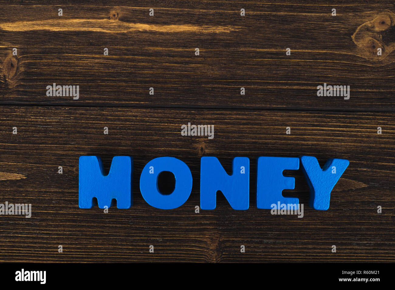 MONEY text letters word on wood table, with copy space for add ...