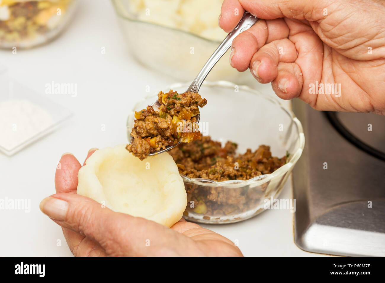 Preparation steps of traditional Colombian dish called stuffed potatoes ...