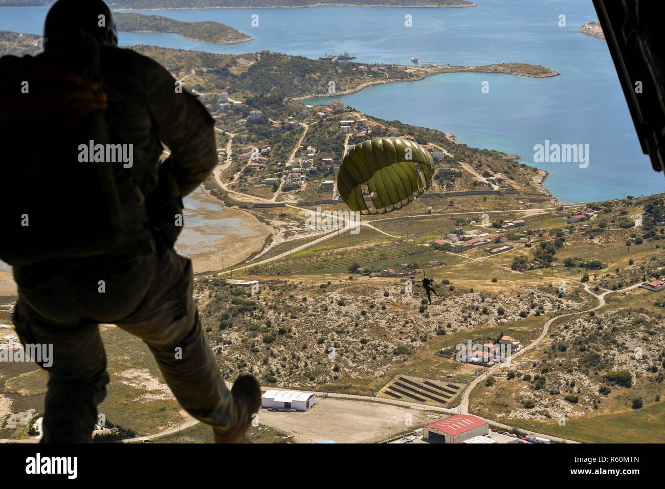 A Greek paratrooper conducts a military free-fall jump from a U.S. Air ...