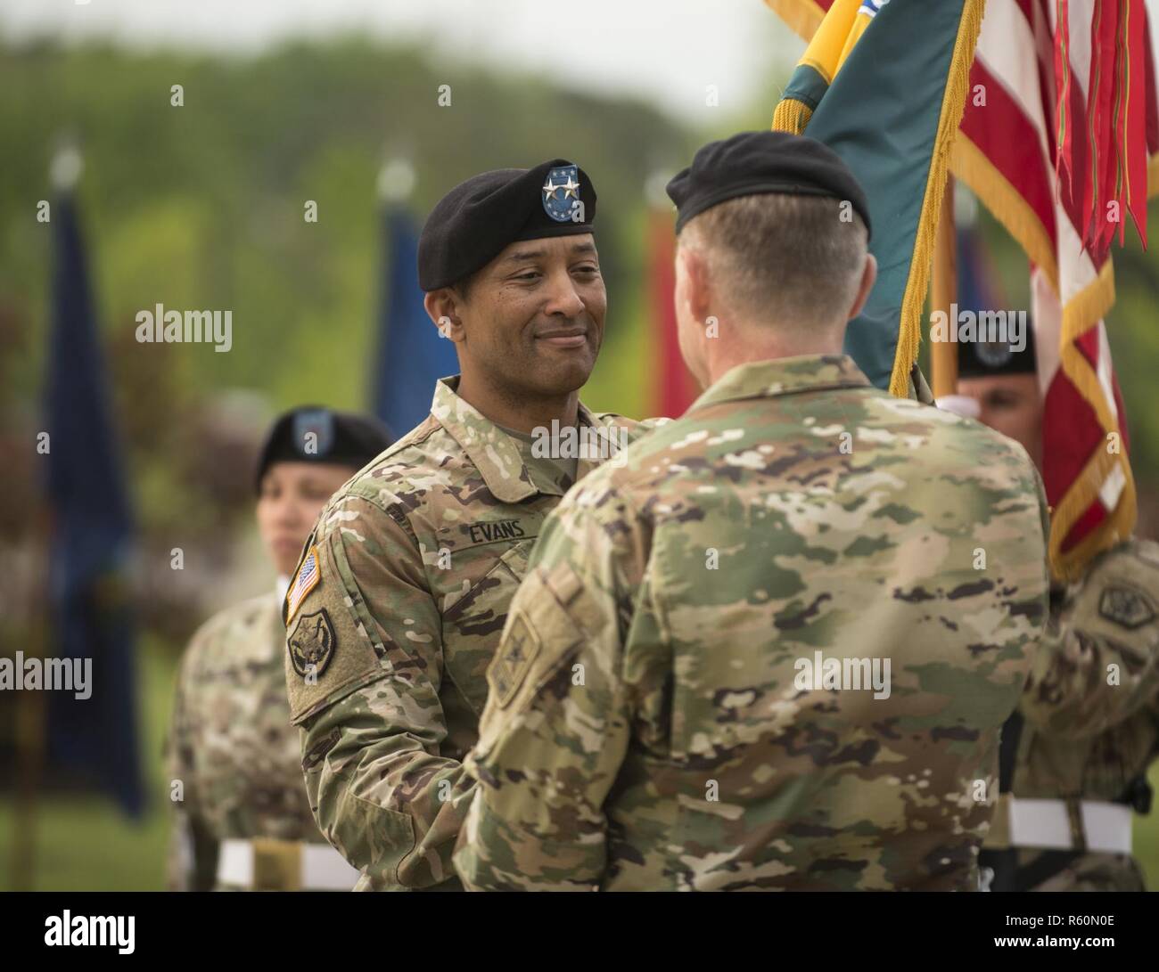 Incoming HRC commander, Maj. Gen. Jason T. Evans (left), accepts the ...