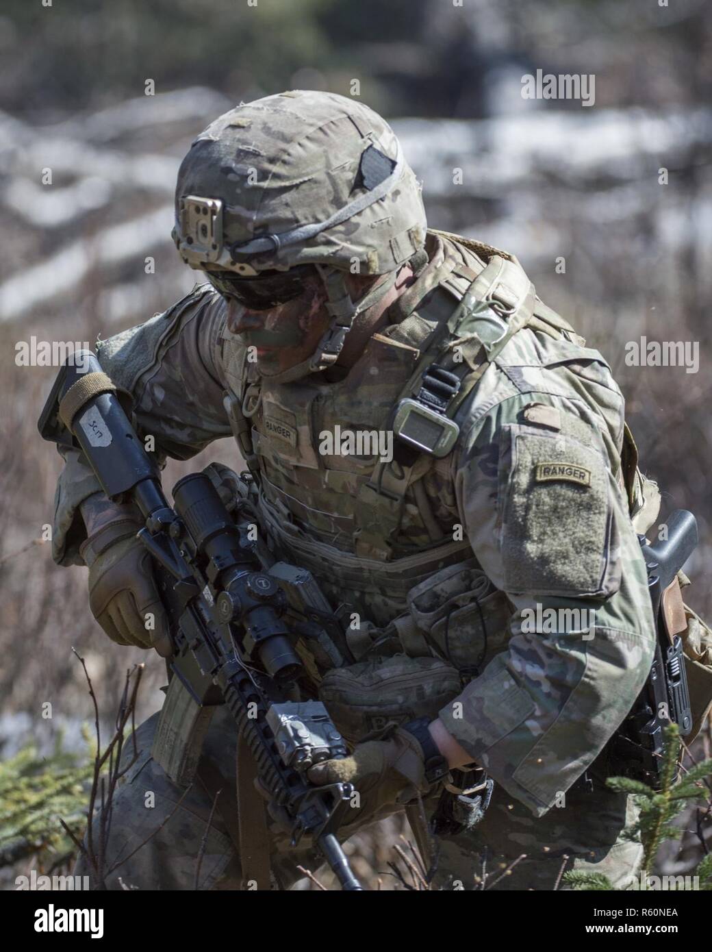A paratrooper assigned to Scout Platoon, Headquarters and Headquarters ...