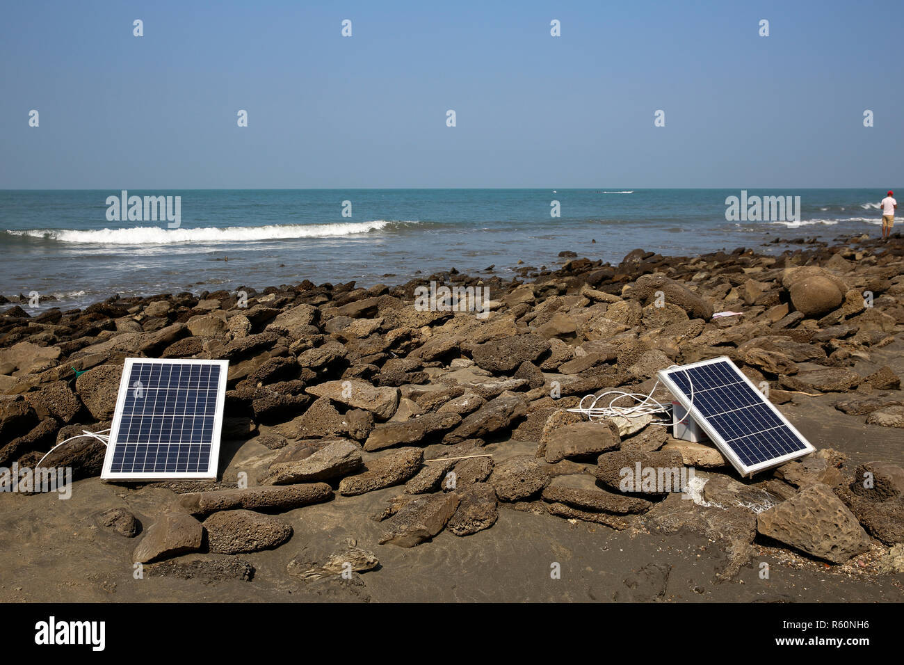 Solar panels lie under the sun on the sea beach at Saint Martin Island ...