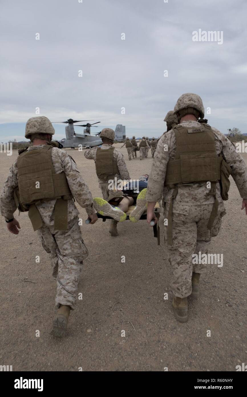 U.S. Navy Corpsmen with the 15th Marine Expeditionary Unit transport a ...