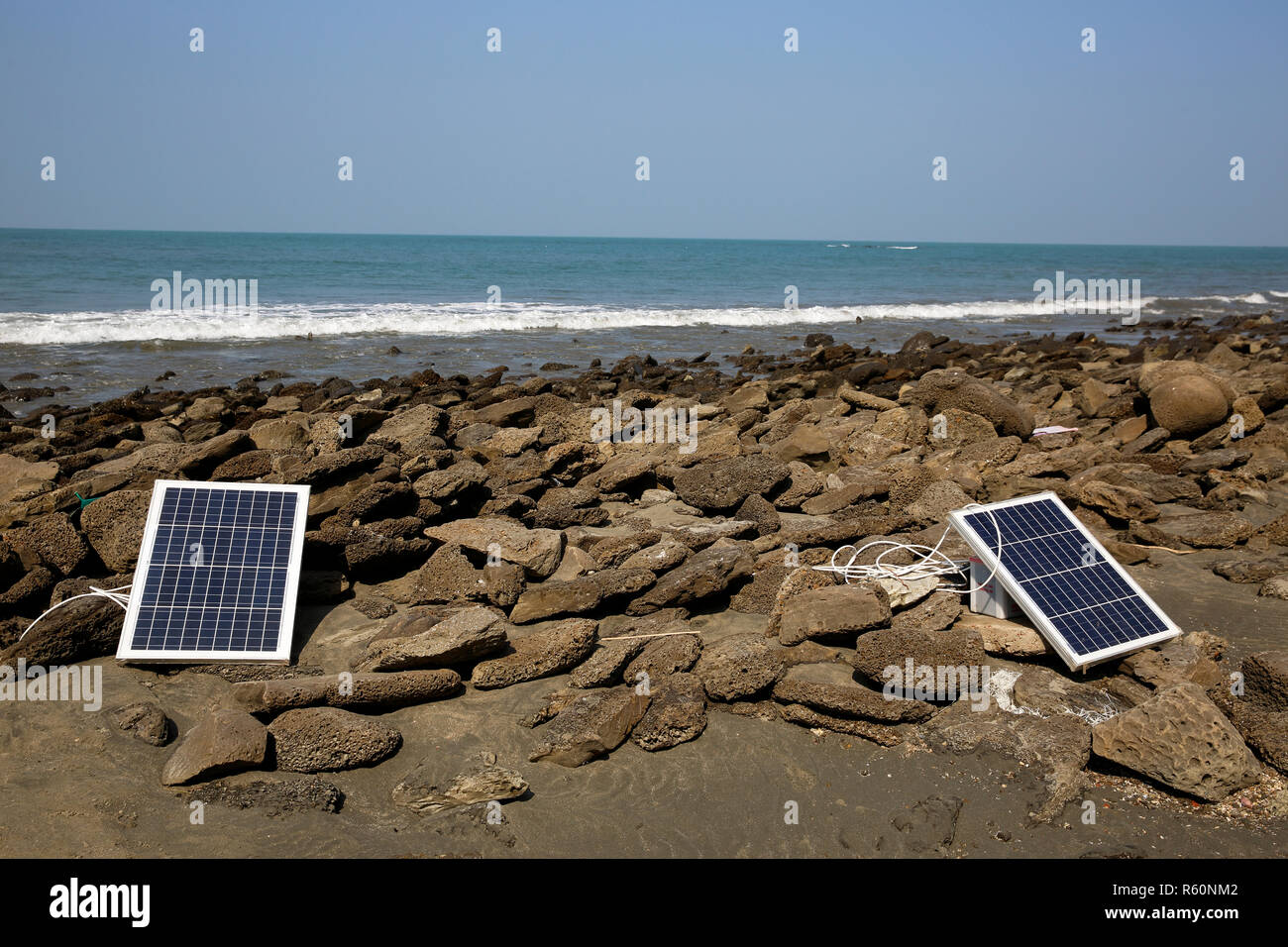 Solar panels lie under the sun on the sea beach at Saint Martin Island ...