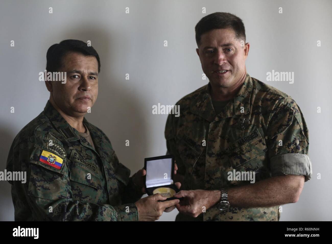 Colonel Ronier Ramirez, Ecuador (Left), presents Colonel Sean Killeen ...