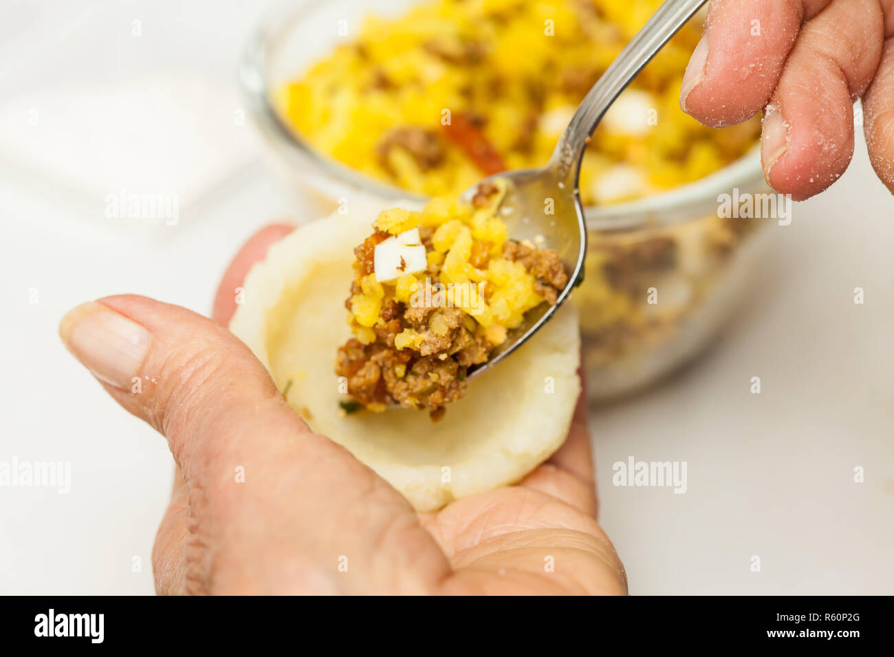 Preparation steps of traditional Colombian dish called stuffed potatoes ...