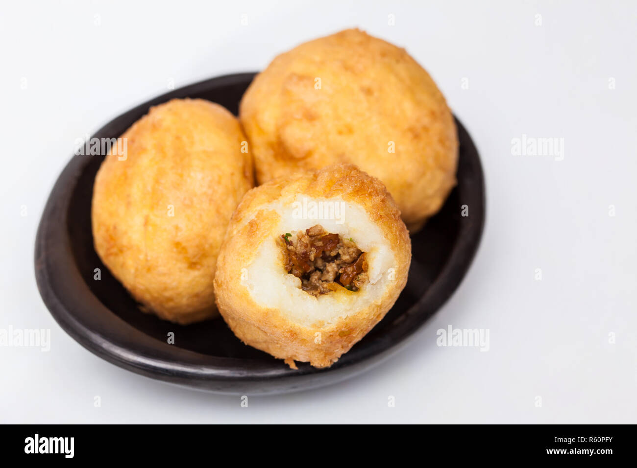 Preparation steps of traditional Colombian dish called stuffed potatoes ...