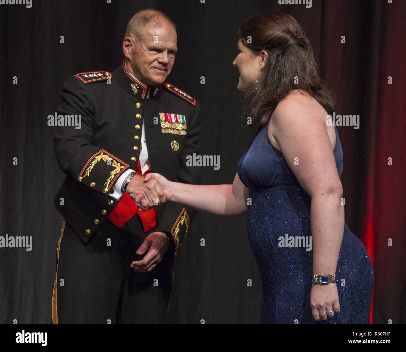 Commandant of the Marine Corps Gen. Robert B. Neller, left, shakes ...