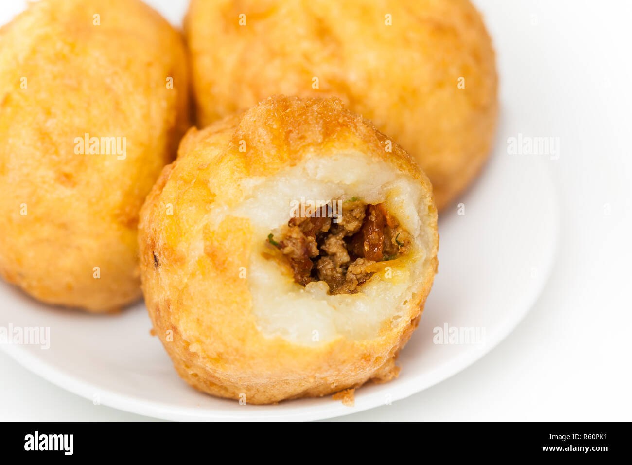 Preparation steps of traditional Colombian dish called stuffed potatoes ...