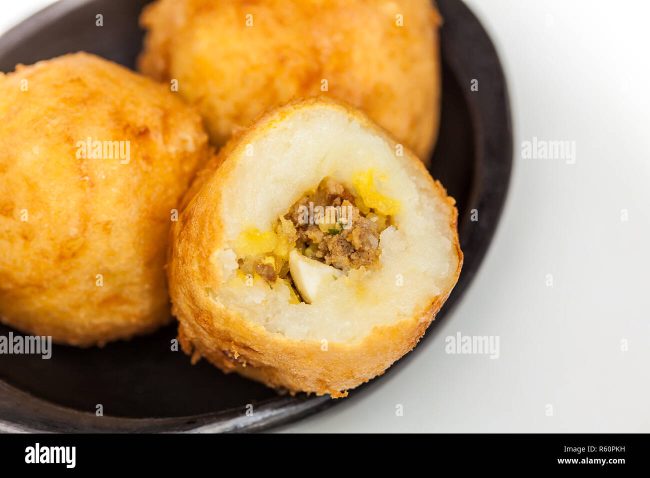 Preparation steps of traditional Colombian dish called stuffed potatoes ...