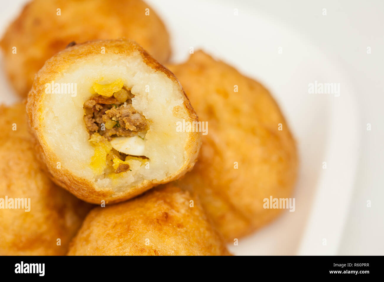 Preparation steps of traditional Colombian dish called stuffed potatoes ...