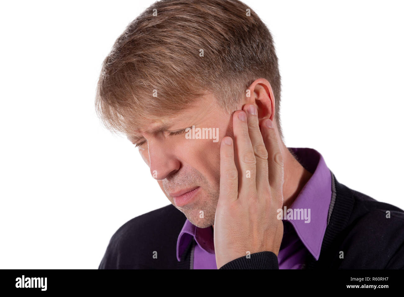 Man has a sore ear. Man suffering from earache Stock Photo - Alamy