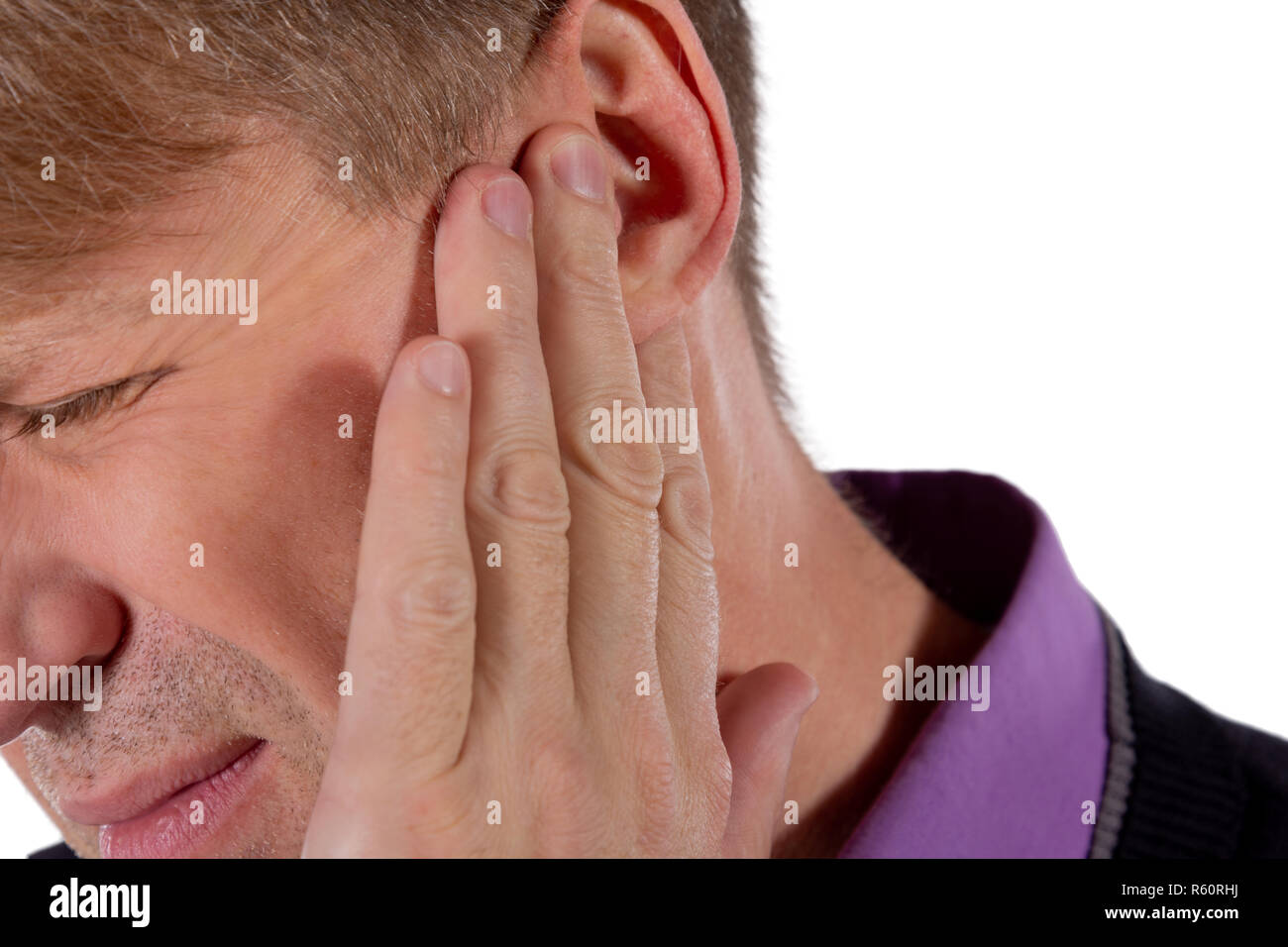 Man has a sore ear. Man suffering from earache Stock Photo - Alamy