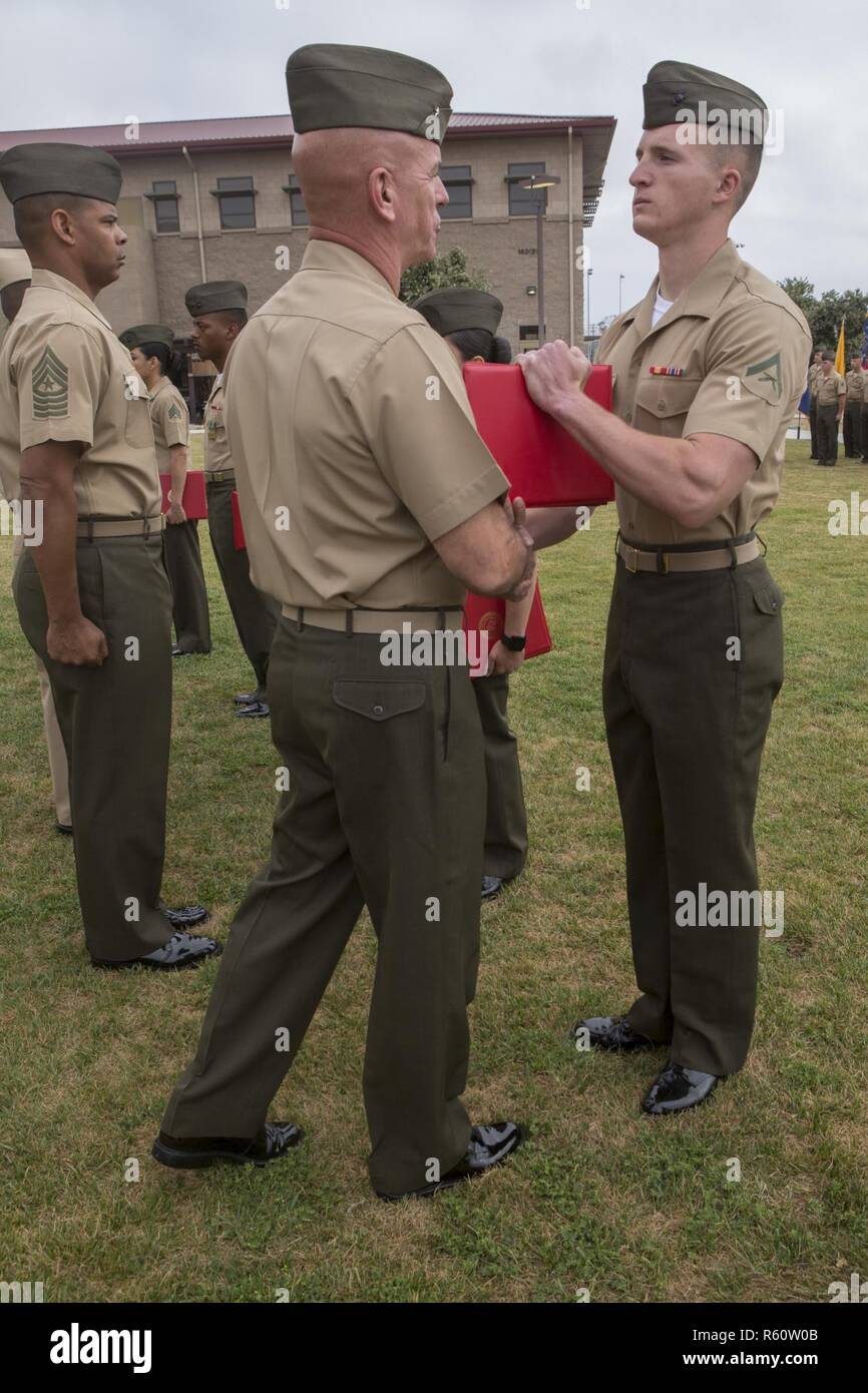 U.S. Marine Lance Cpl. Nicholas Greenisen receives a Marine of the ...
