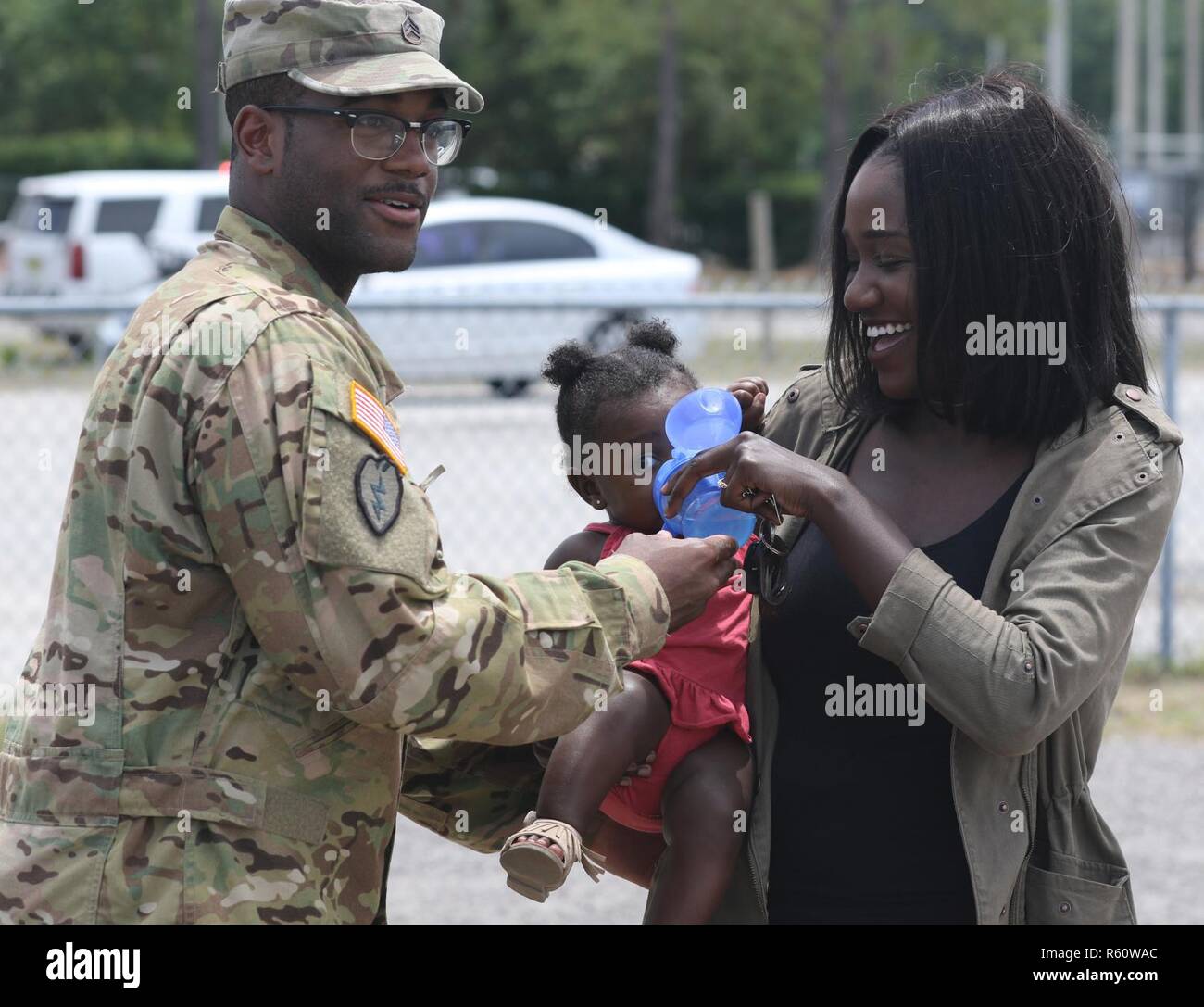 Staff Sgt. Chad Butler reunites with his wife, Cassie, and his daughter ...