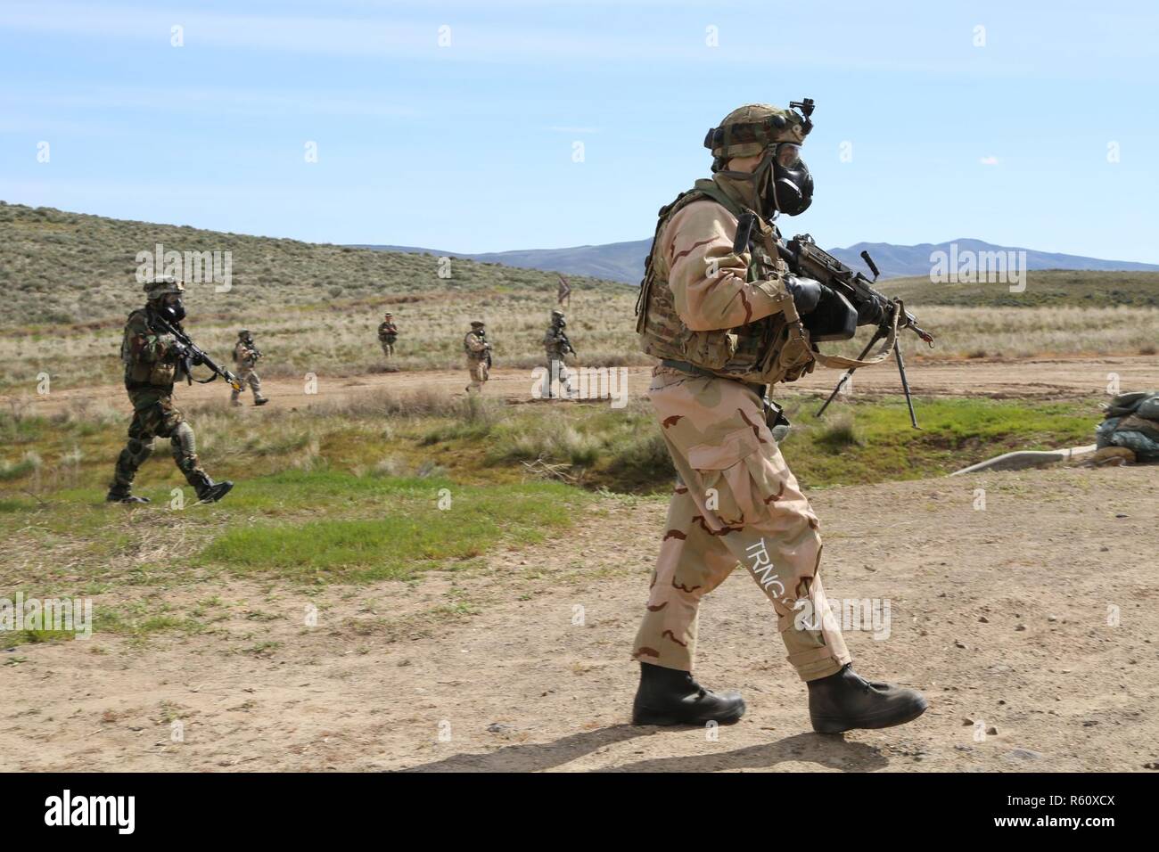 U.S. Soldiers from 20th CBRNE Command, tactically move towards a ...