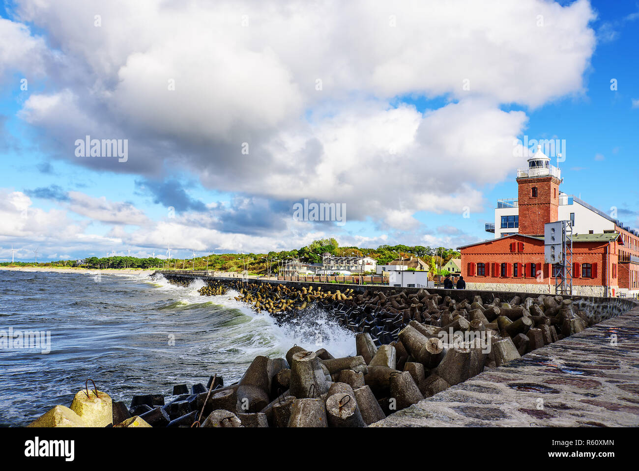 lighthouse coast storm rocks beach darlowko Stock Photo - Alamy