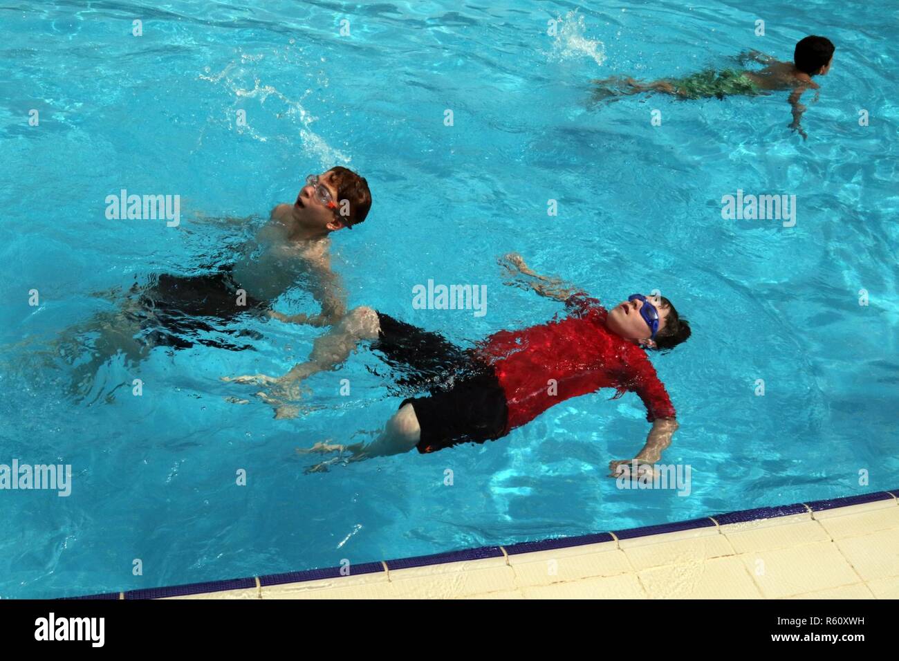 Boy Scouts of Troop 965 Kuwait demonstrate how to back crawl and float ...