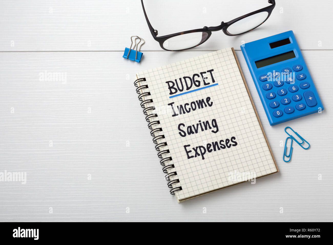 Budget planning concept on white wooden table background Stock Photo ...
