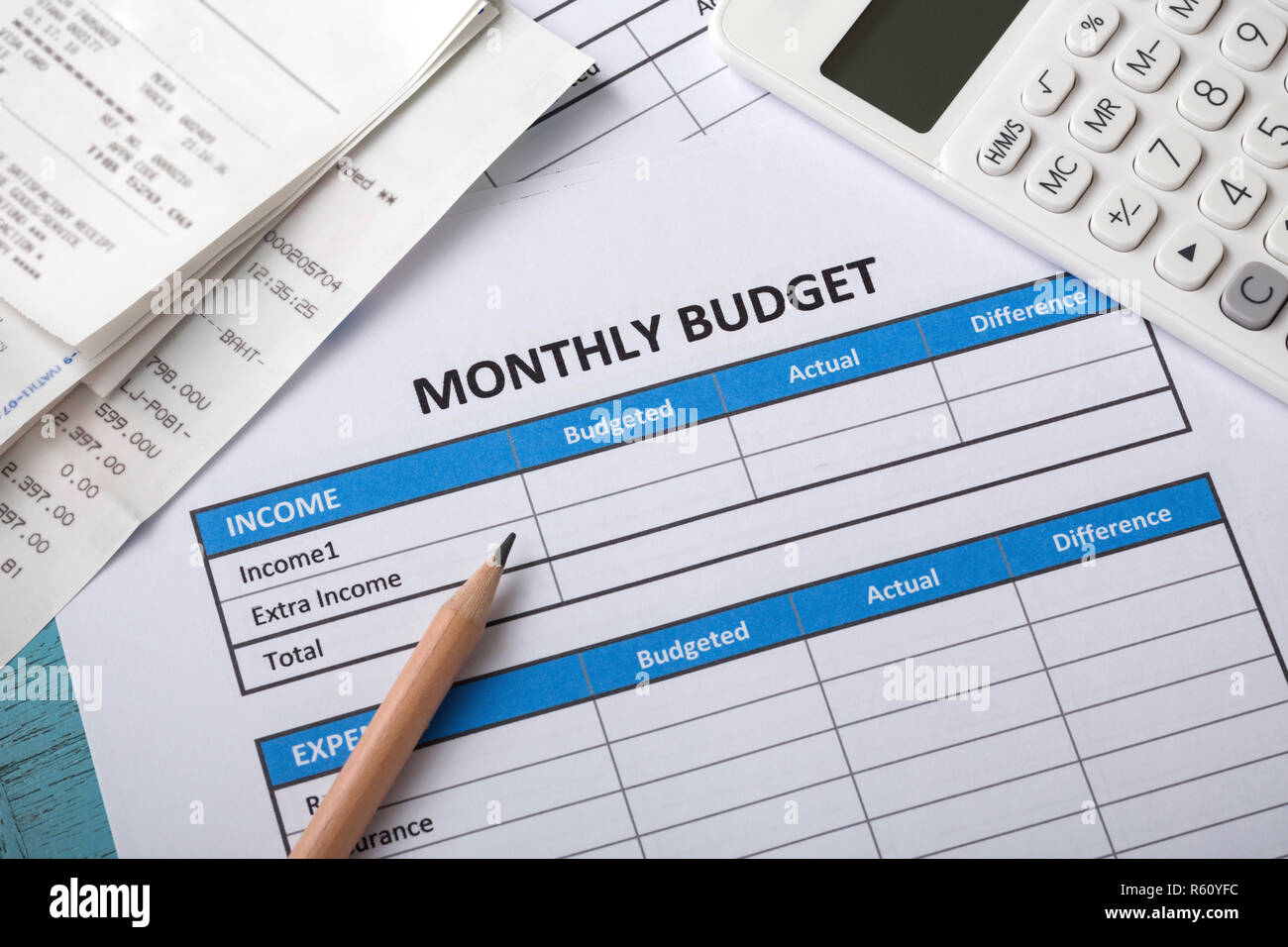 Monthly budget concept with white calculator, bills and pencil Stock ...