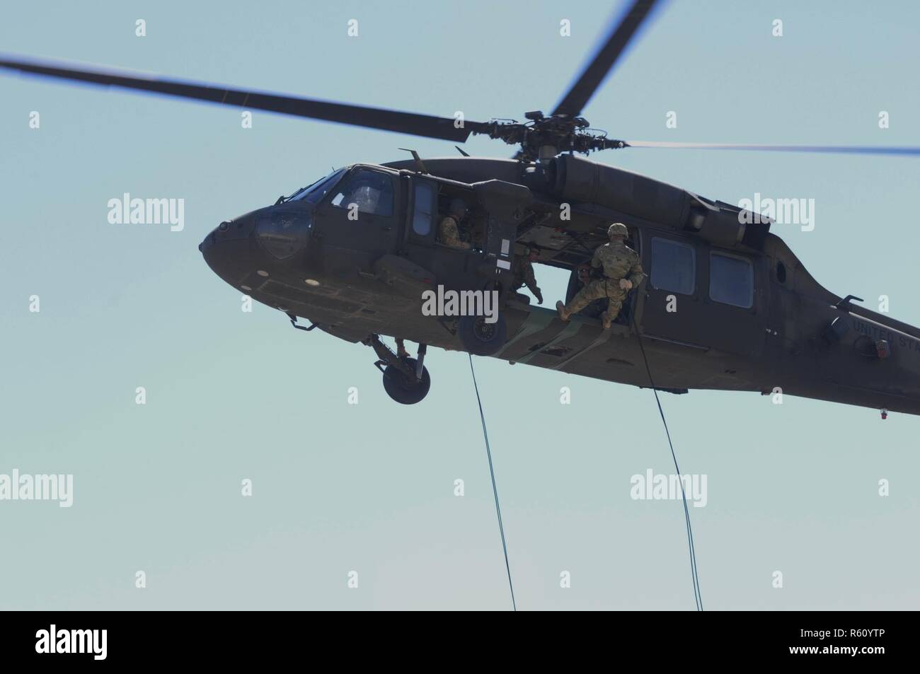 U.S. Army Soldiers prepare to rappel out of a UH-60 helicopter on April ...